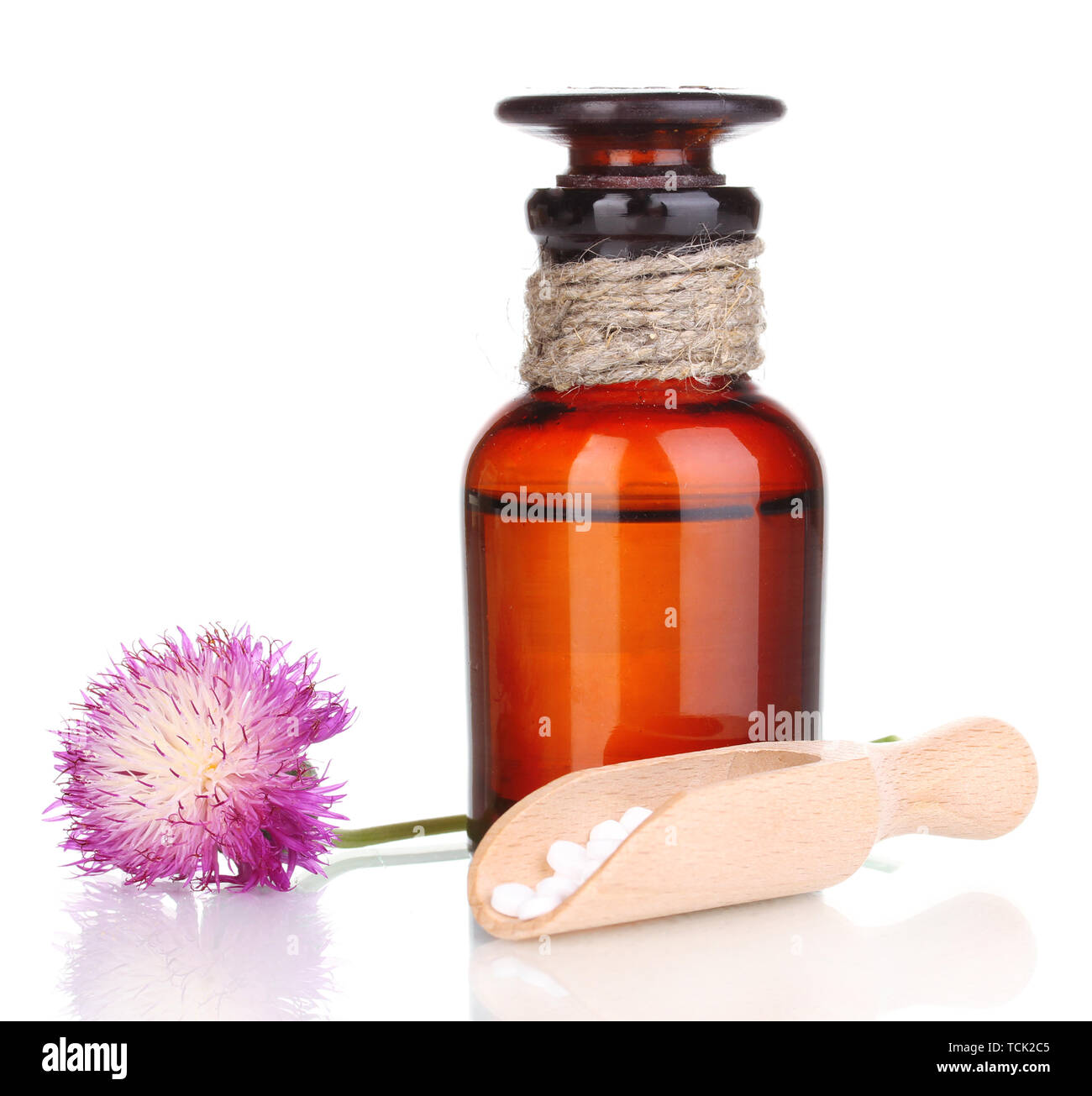 medicine bottle with tablets and flowers isolated on white Stock Photo ...