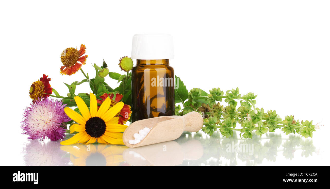 medicine bottle with tablets and flowers isolated on white Stock Photo ...