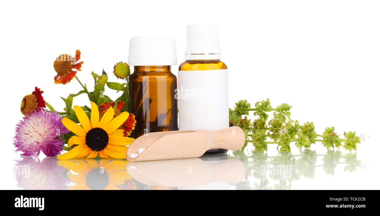 medicine bottles with tablets and flowers isolated on white Stock Photo ...