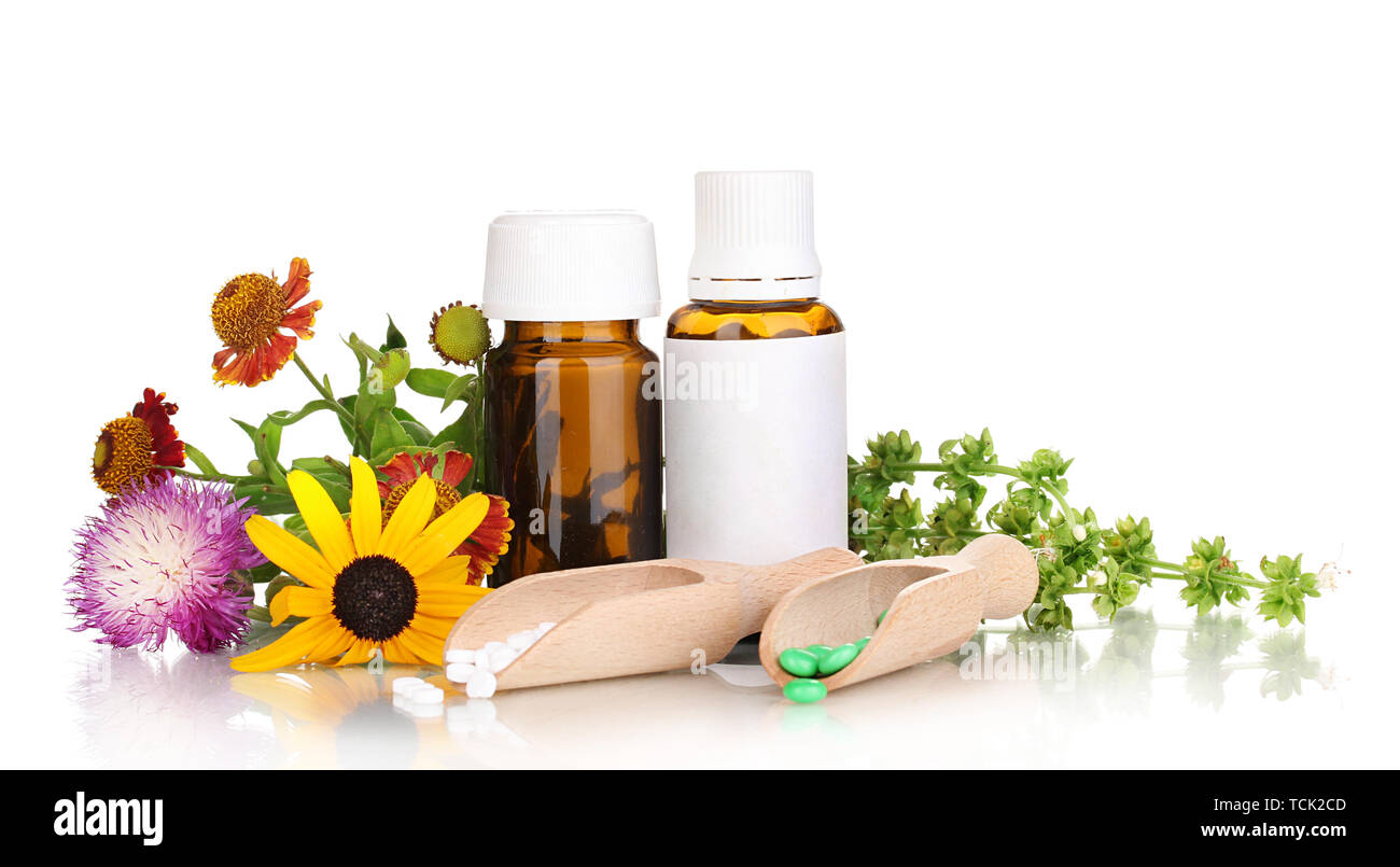 medicine bottles with tablets and flowers isolated on white Stock Photo ...