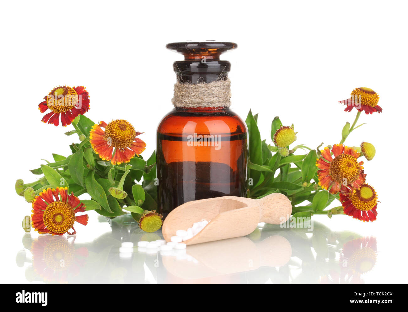 medicine bottle with tablets and flowers isolated on white Stock Photo ...
