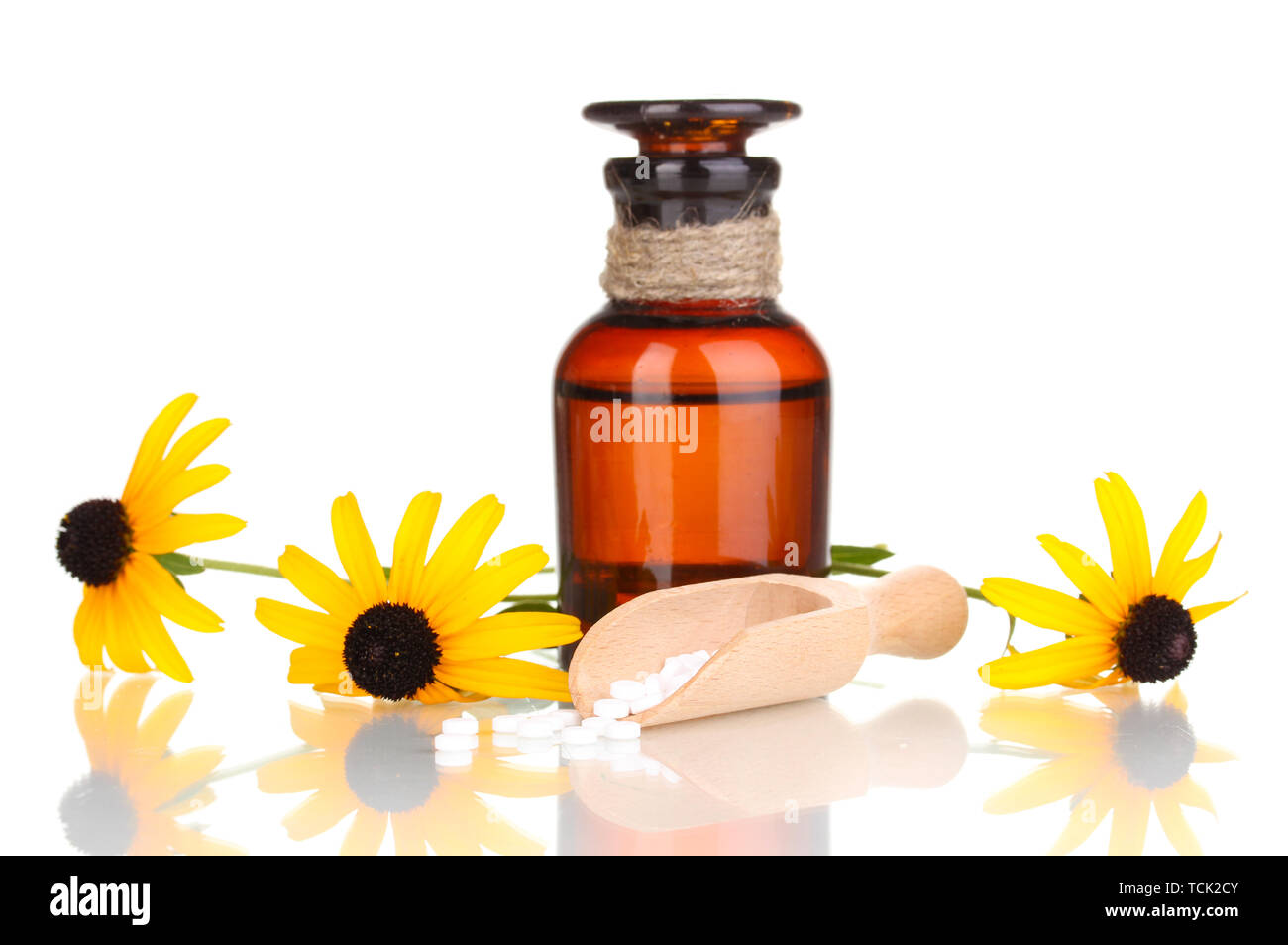 medicine bottle with tablets and flowers isolated on white Stock Photo ...