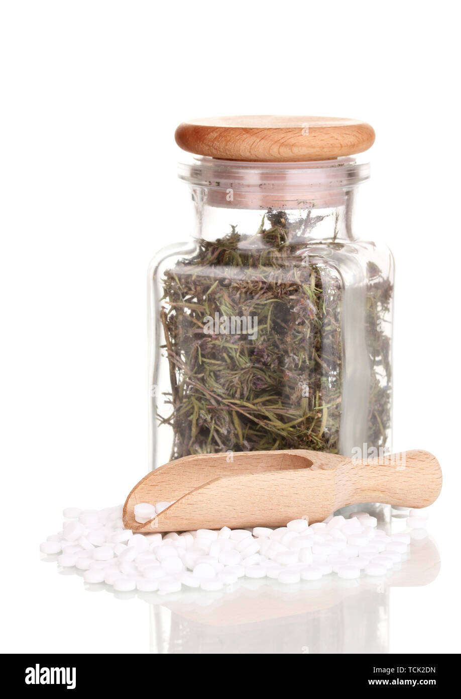 tablets and bottle with herbs isolated on white Stock Photo - Alamy