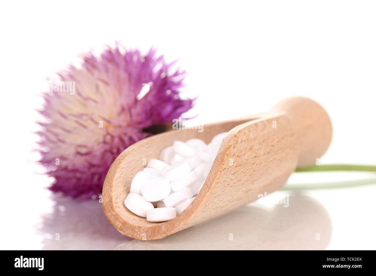 homeopathic tablets and flower isolated on white Stock Photo - Alamy