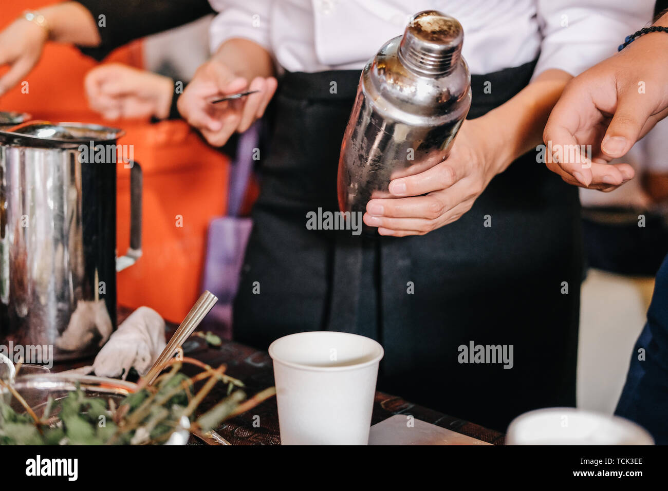 bartender preparing mocktail beverage at bar restaurant Stock Photo - Alamy