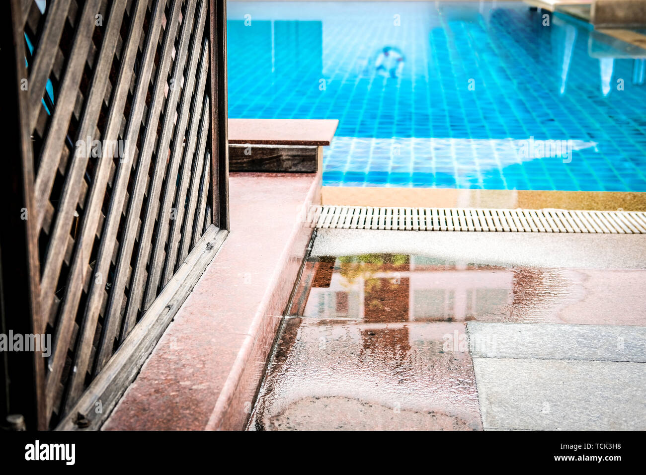 wood partition near swimming pool in hotel resort. summer holiday ...