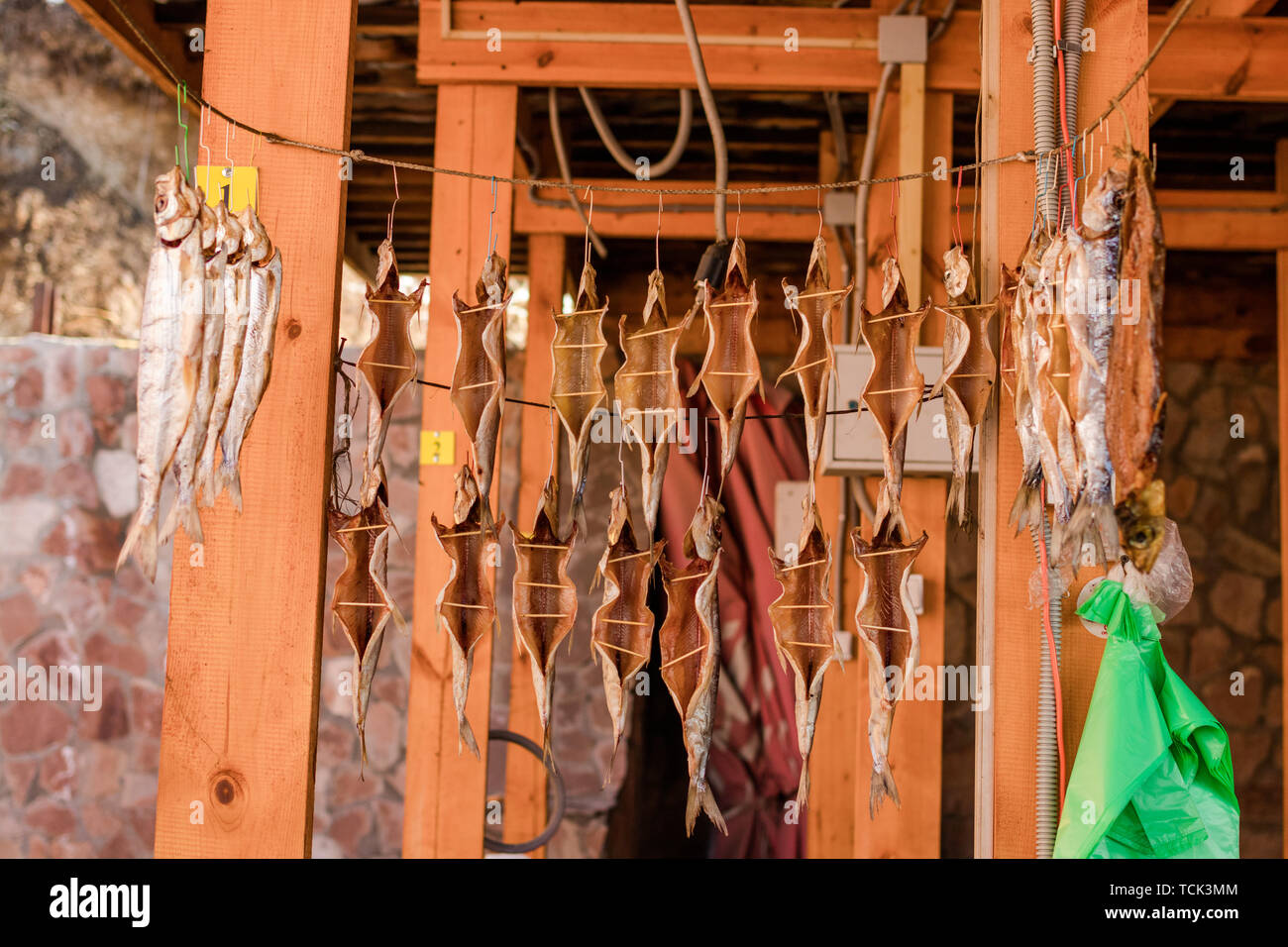 Baikal fish hot smoked and dried on the street market. Listvyanka ...