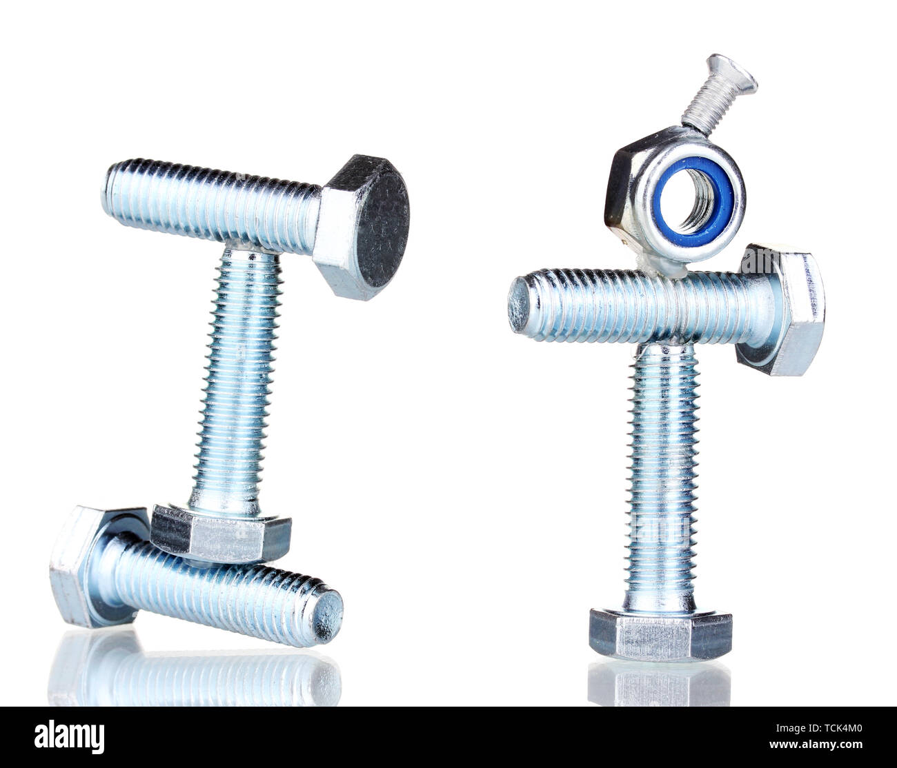 Stacks of balanced screws isolated on white Stock Photo - Alamy