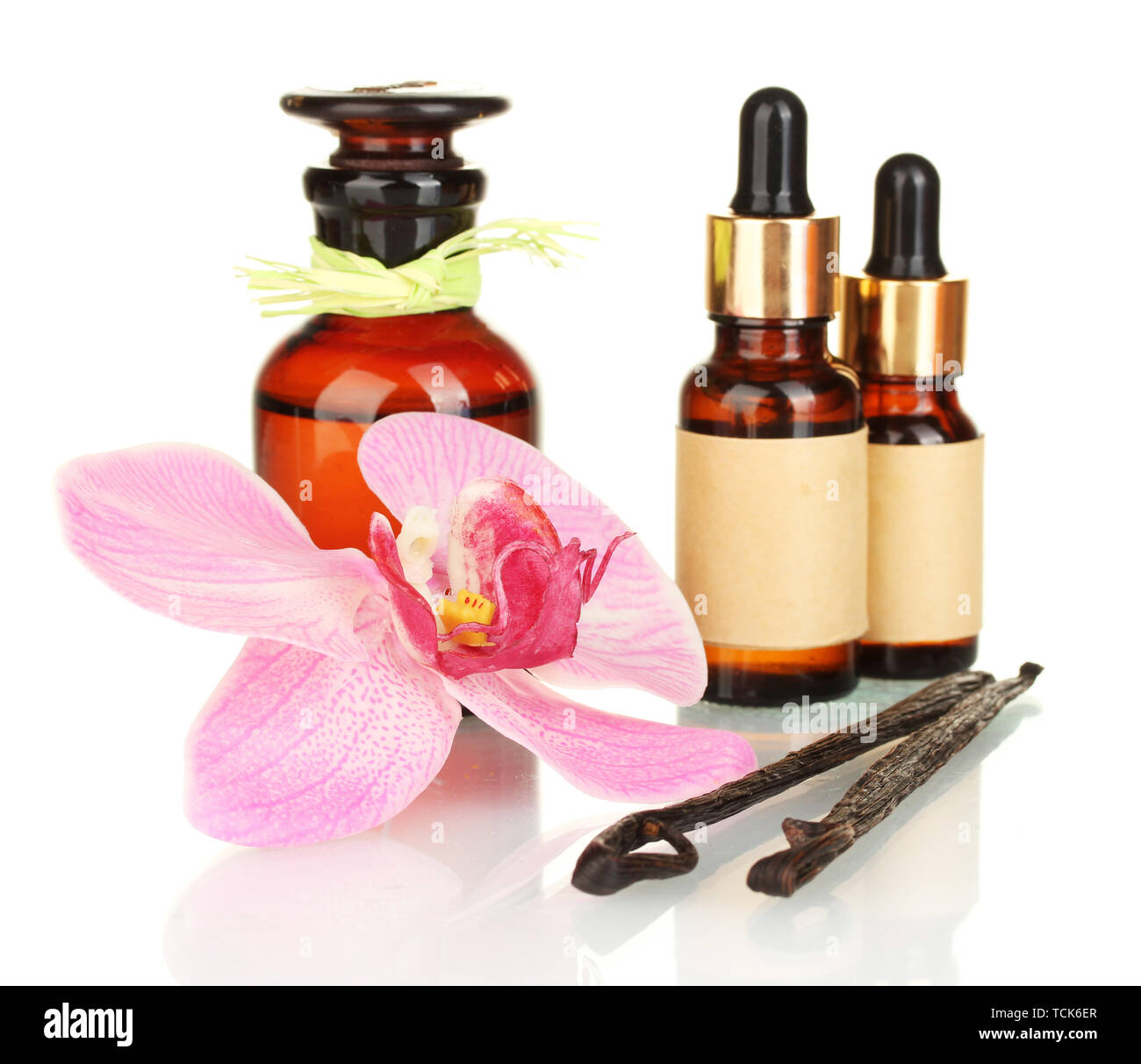 Vanilla pods with essential oil isolated on white Stock Photo - Alamy