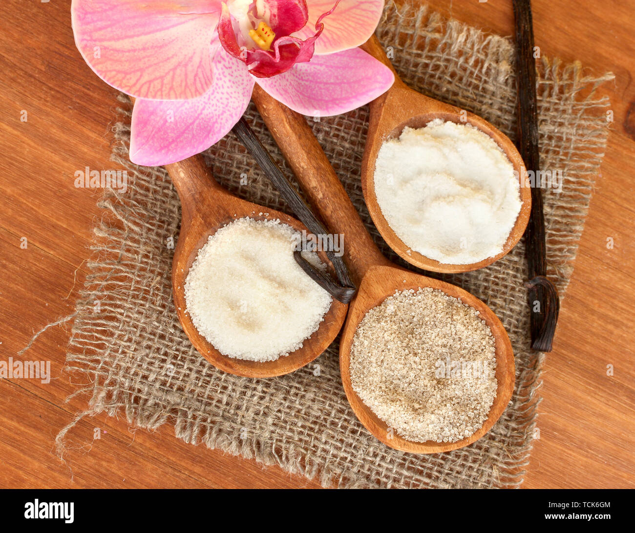 Vanilla pods with vanilla and vanilla sugar in wooden spoons on wooden background close-up Stock ...