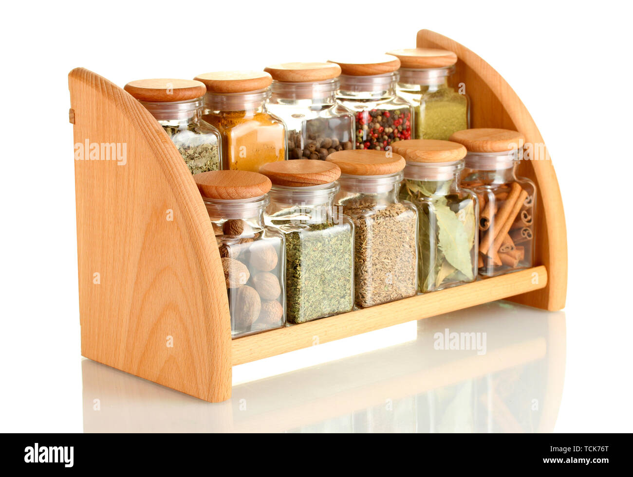 powder spices in glass jars on wooden shelf isolated on white Stock ...