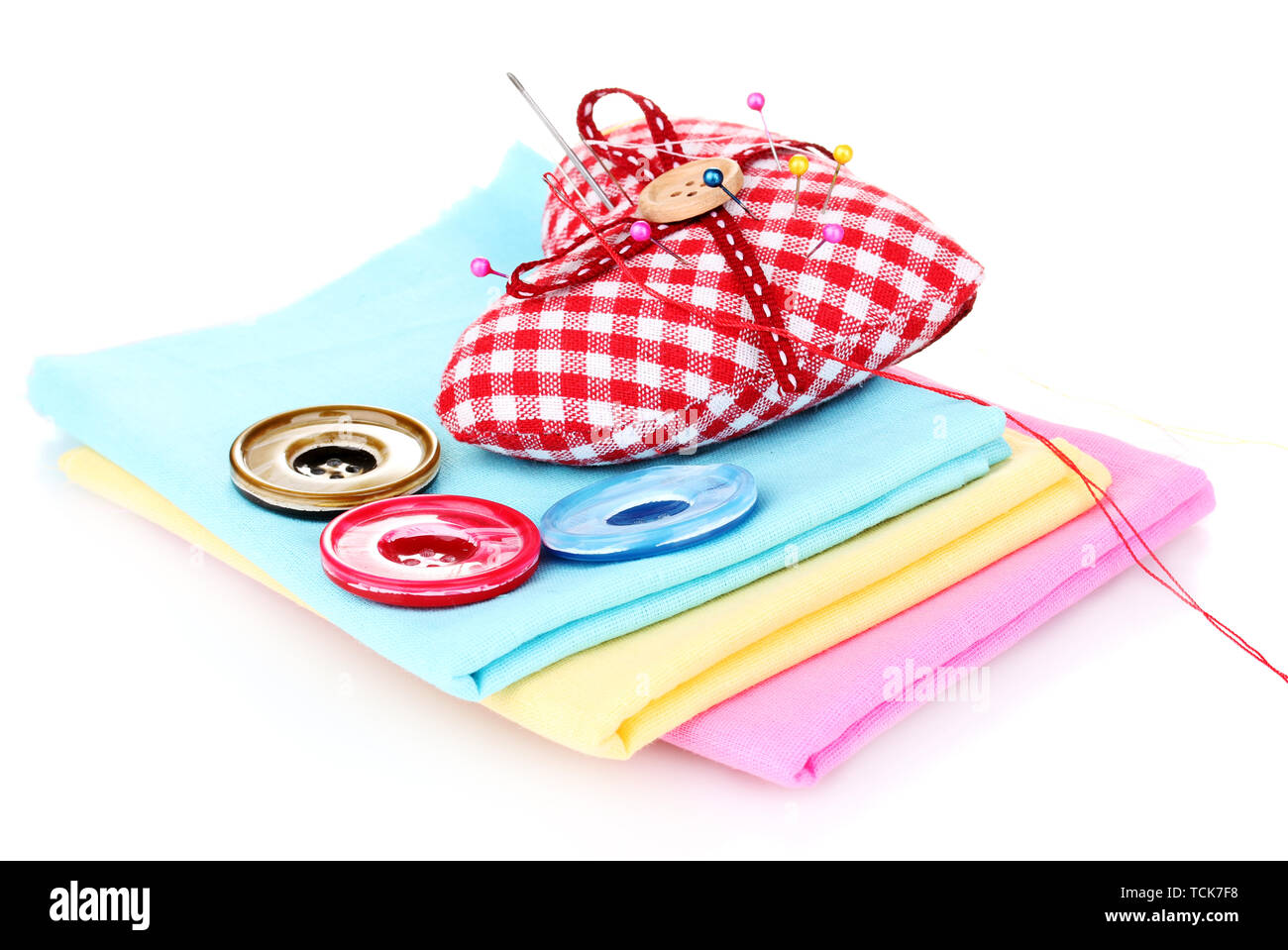 Sewing accessories and fabric isolated on white Stock Photo - Alamy