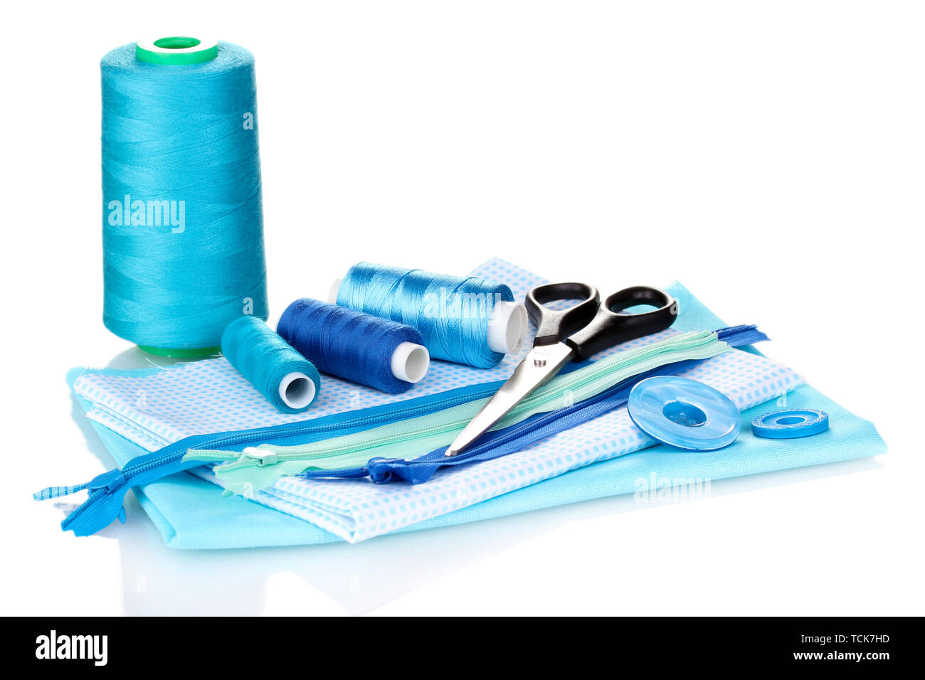 Sewing accessories and fabric isolated on white Stock Photo - Alamy