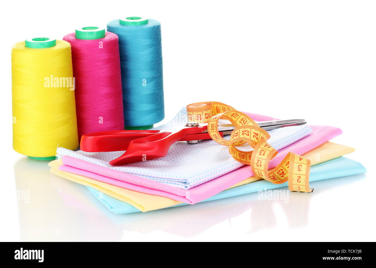 Sewing accessories and fabric isolated on white Stock Photo - Alamy
