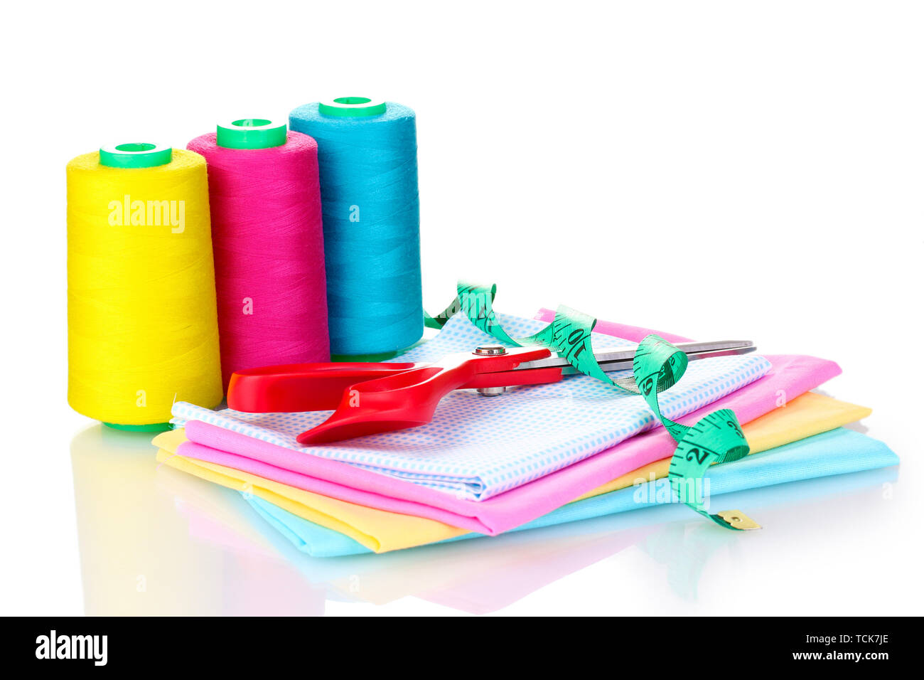 Sewing accessories and fabric isolated on white Stock Photo - Alamy