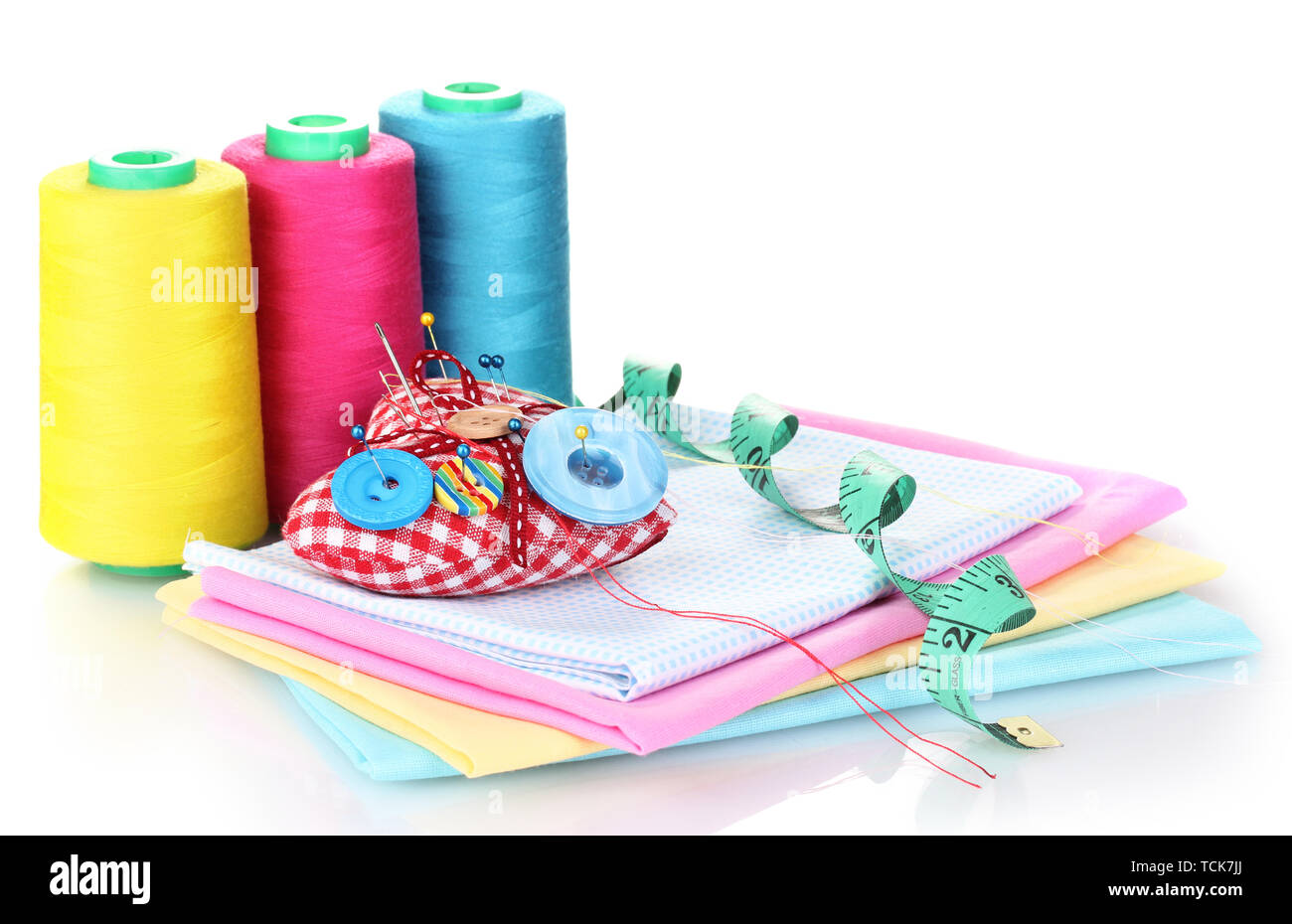 Sewing accessories and fabric isolated on white Stock Photo - Alamy