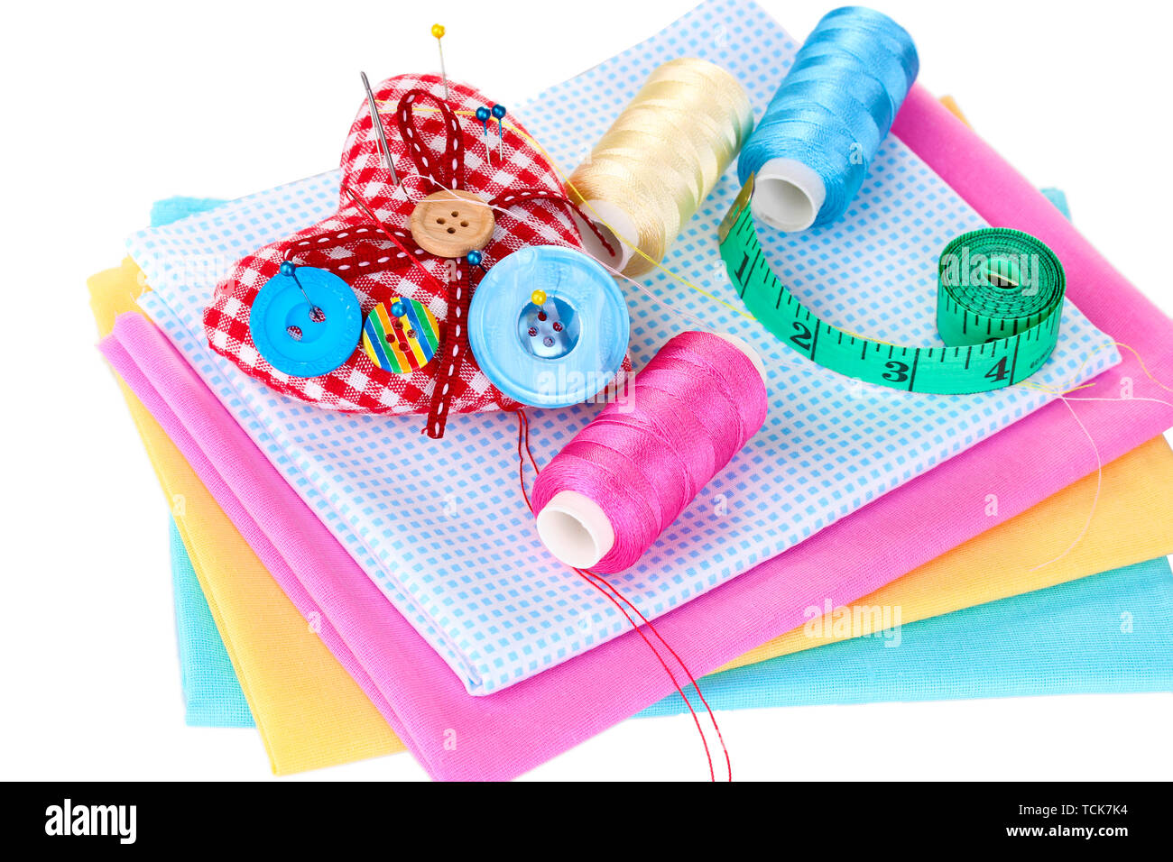 Sewing accessories and fabric isolated on white Stock Photo - Alamy