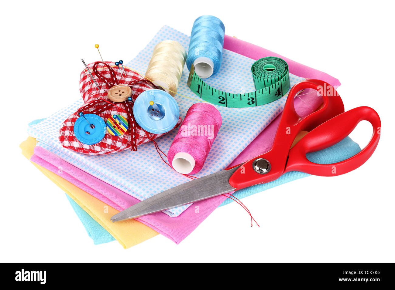 Sewing accessories and fabric isolated on white Stock Photo - Alamy