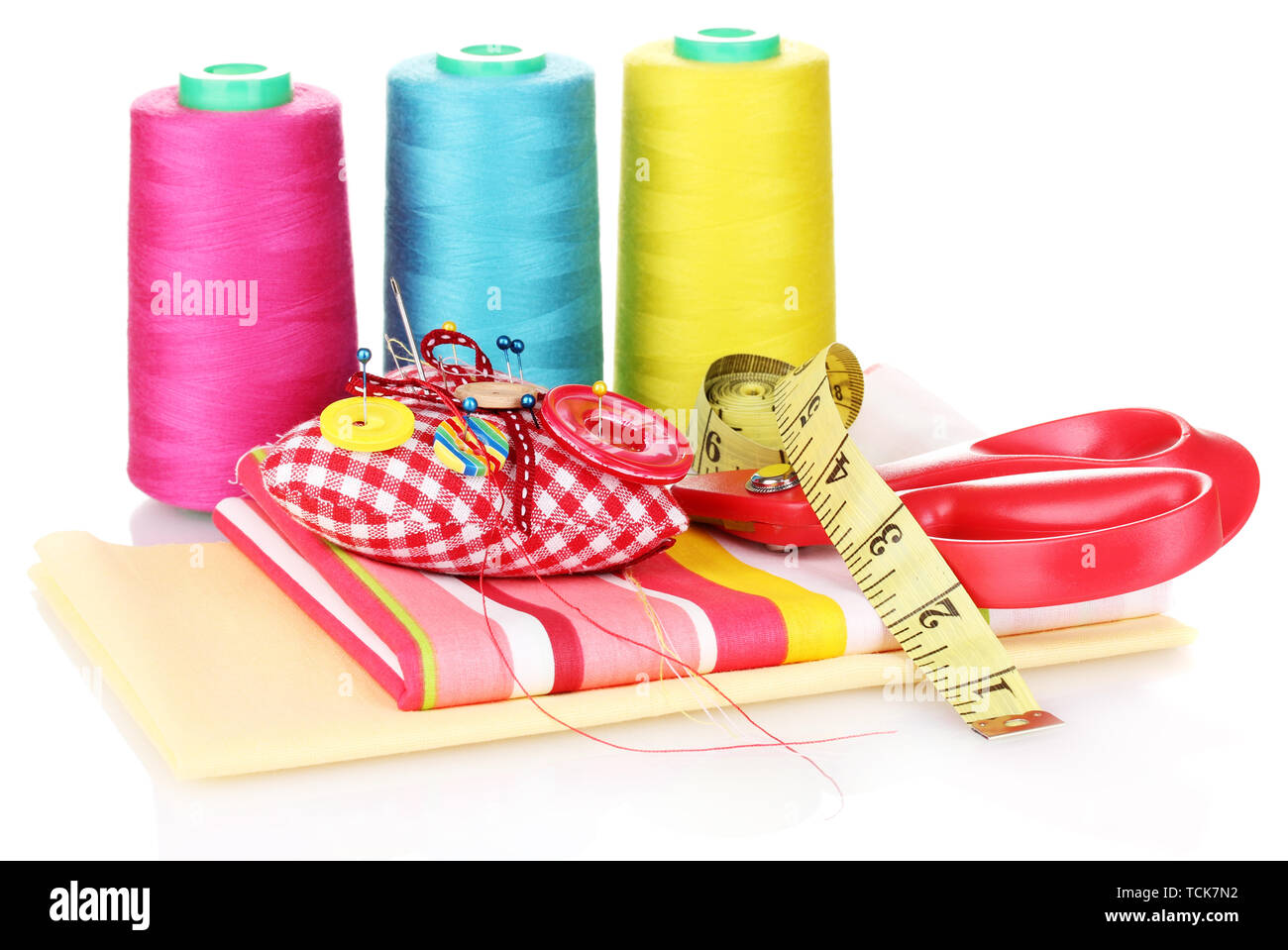 Sewing accessories and fabric isolated on white Stock Photo - Alamy