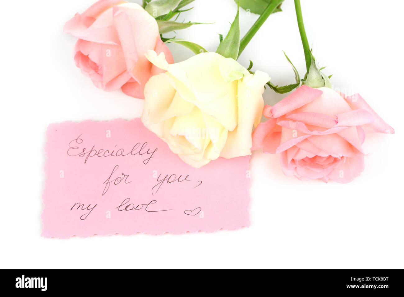 Three roses with card isolated on white Stock Photo - Alamy