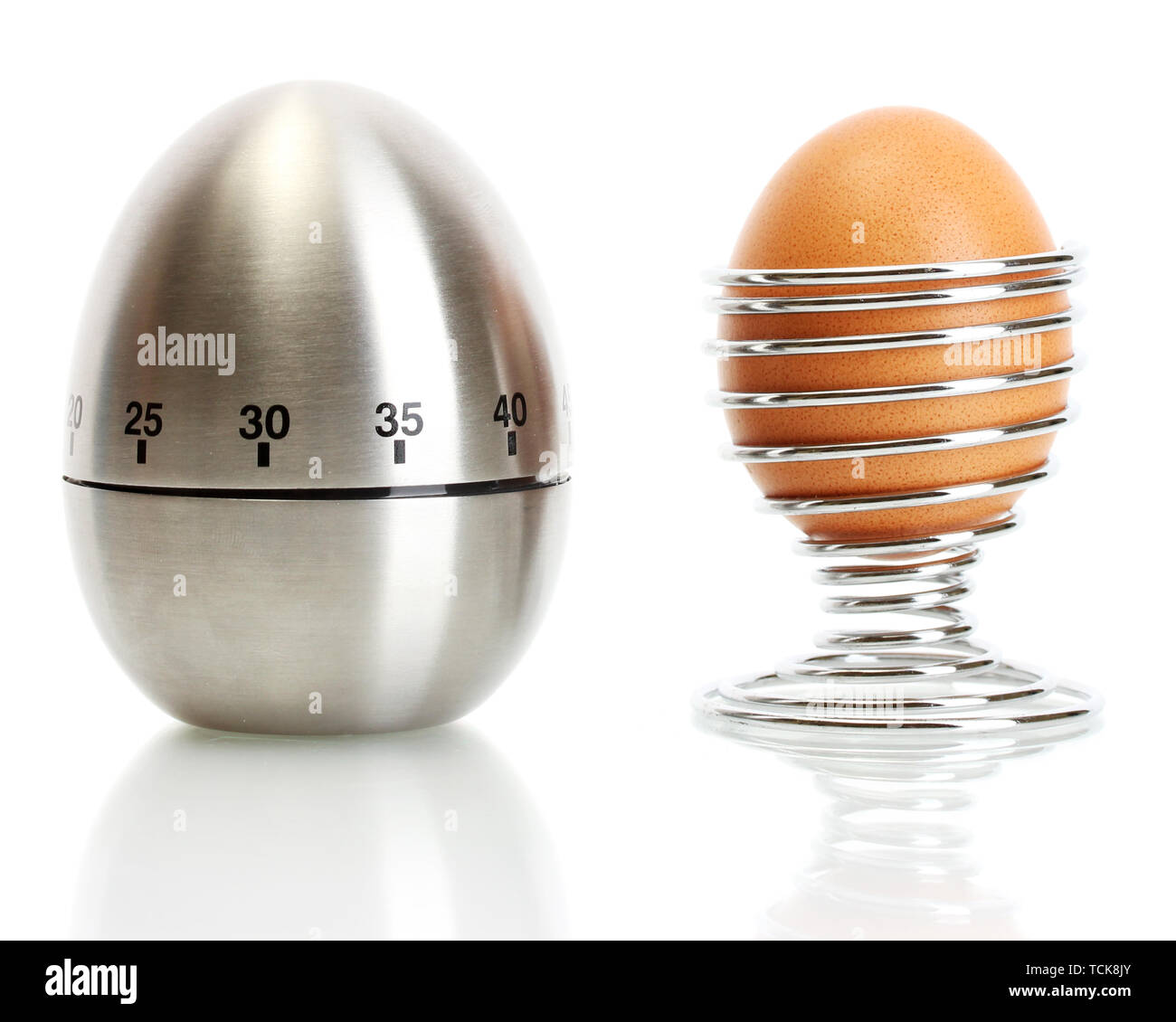 egg timer and egg in metal stand isolated on white Stock Photo - Alamy
