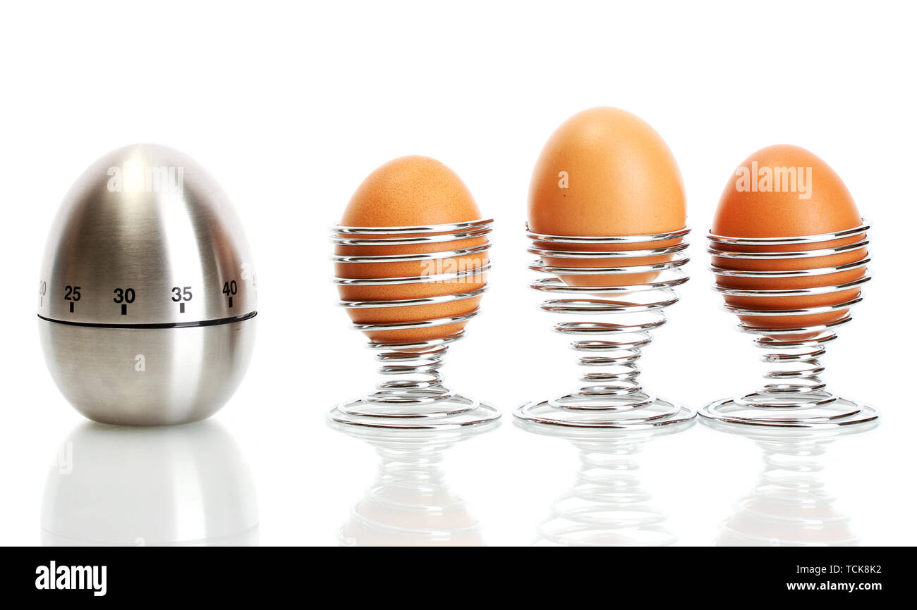 egg timer and egg in metal stand isolated on white Stock Photo - Alamy