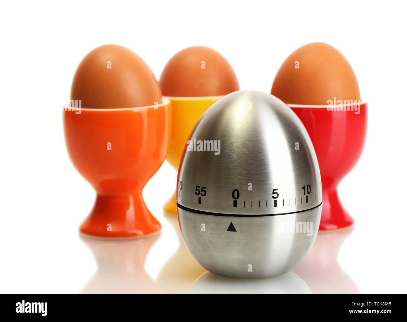 egg timer and egg in color stand isolated on white Stock Photo - Alamy