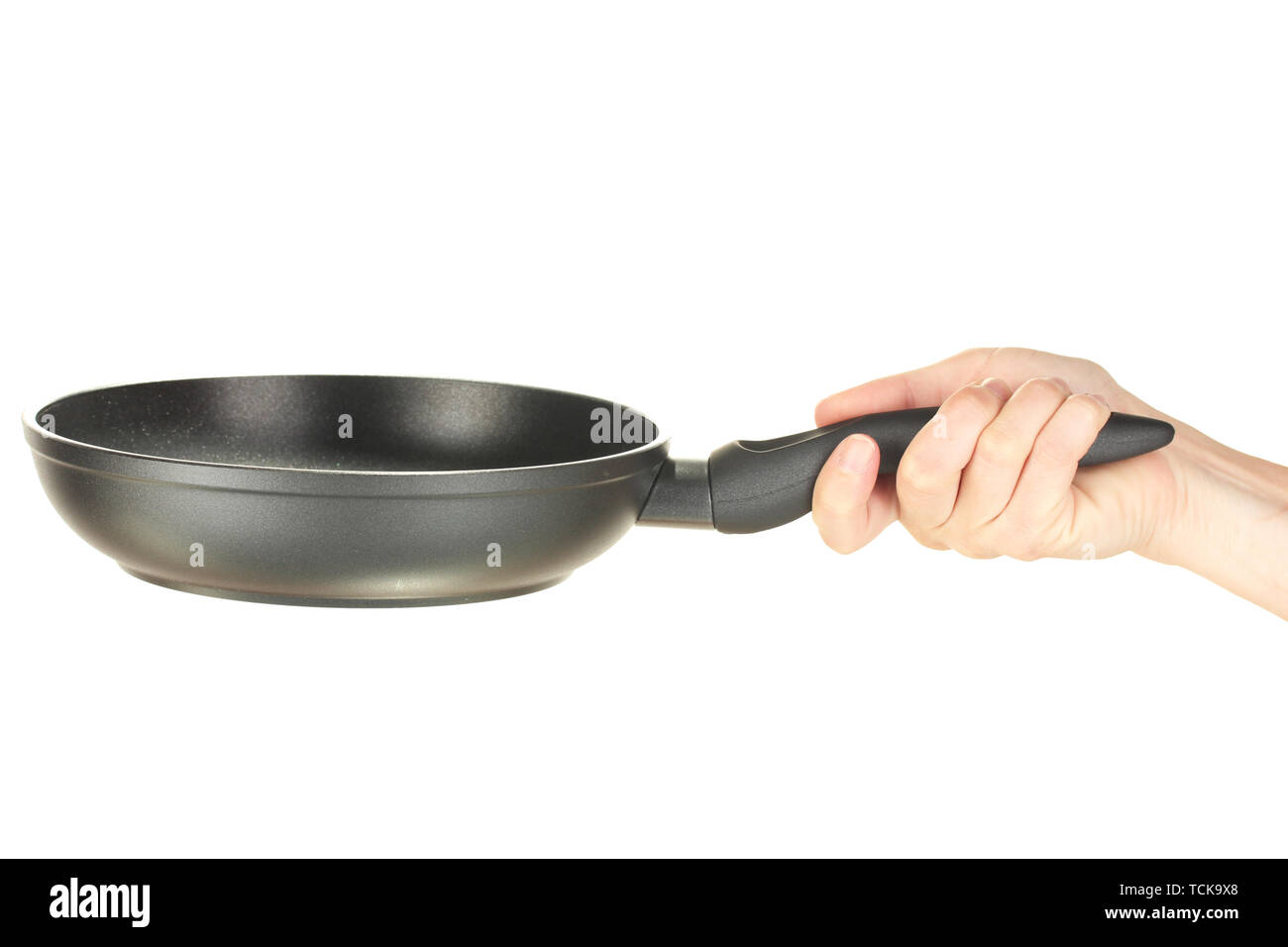 Woman's hand holding a frying pan isolated on white Stock Photo - Alamy