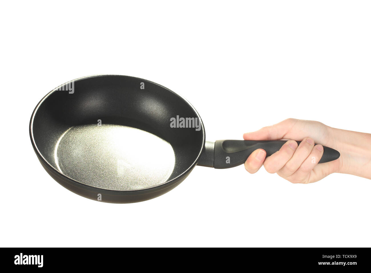 Woman's hand holding a frying pan isolated on white Stock Photo - Alamy