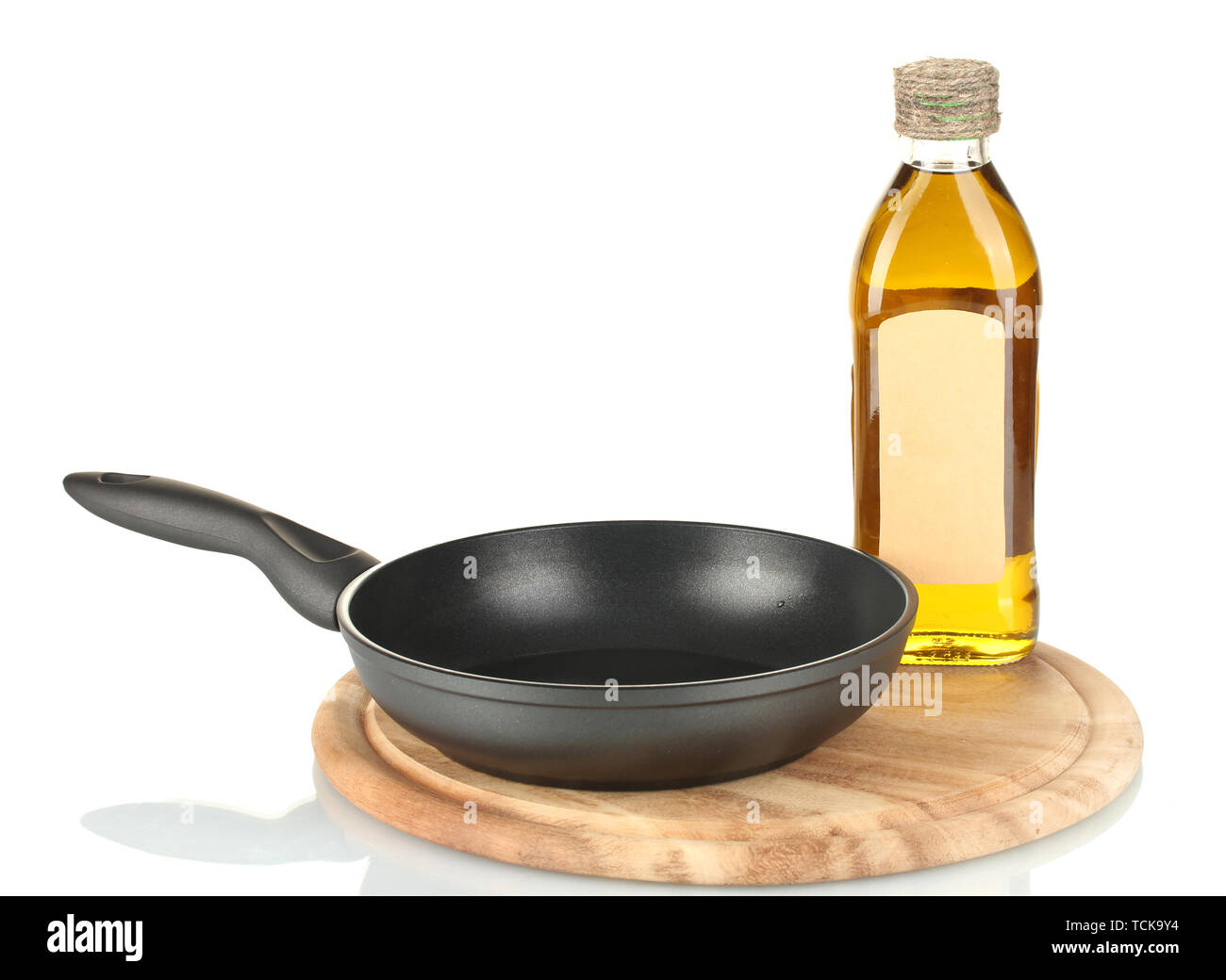 Pan with bottle of oil isolated on white Stock Photo - Alamy