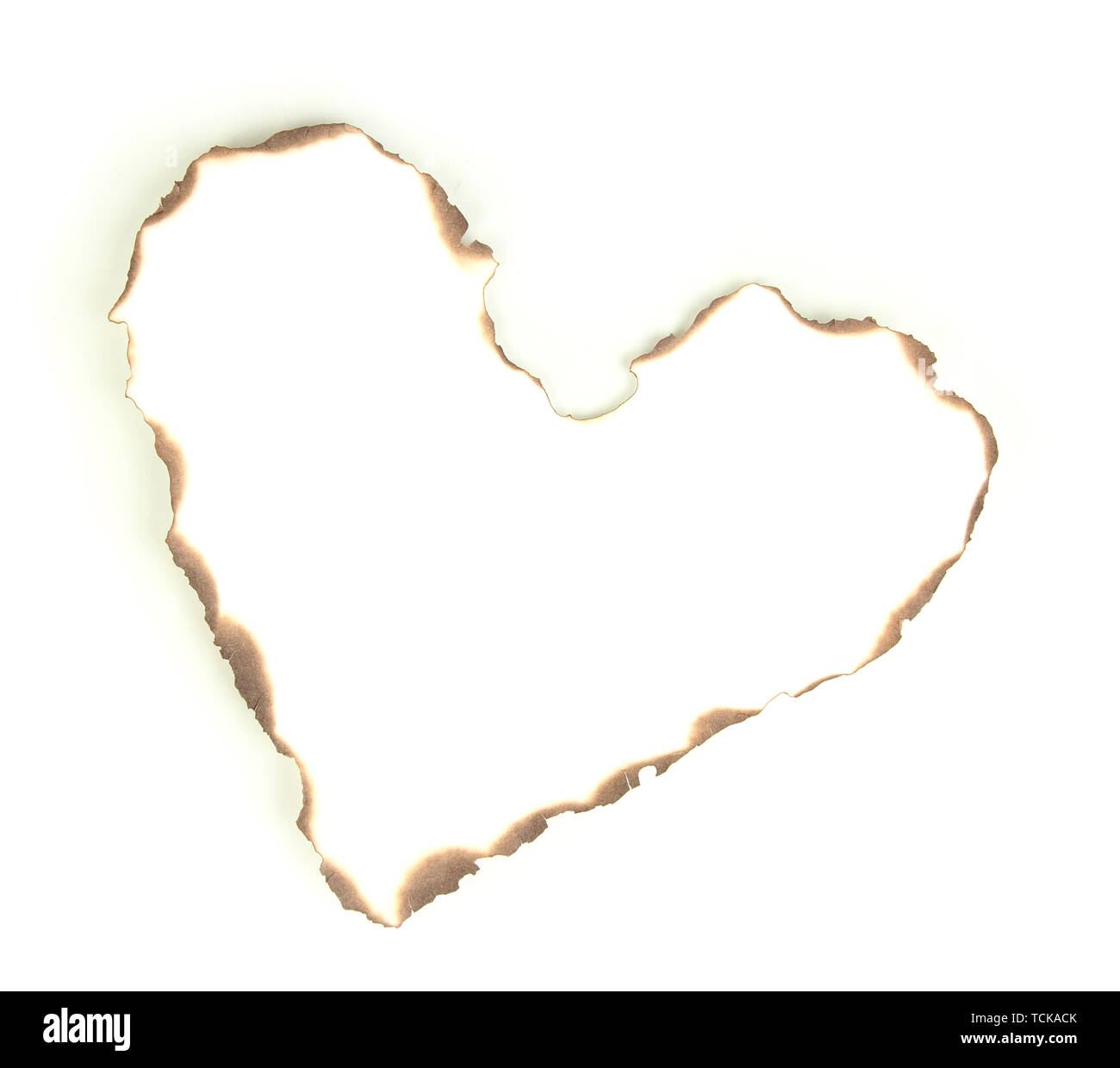 Burnt heart-shaped paper isolated on white Stock Photo - Alamy