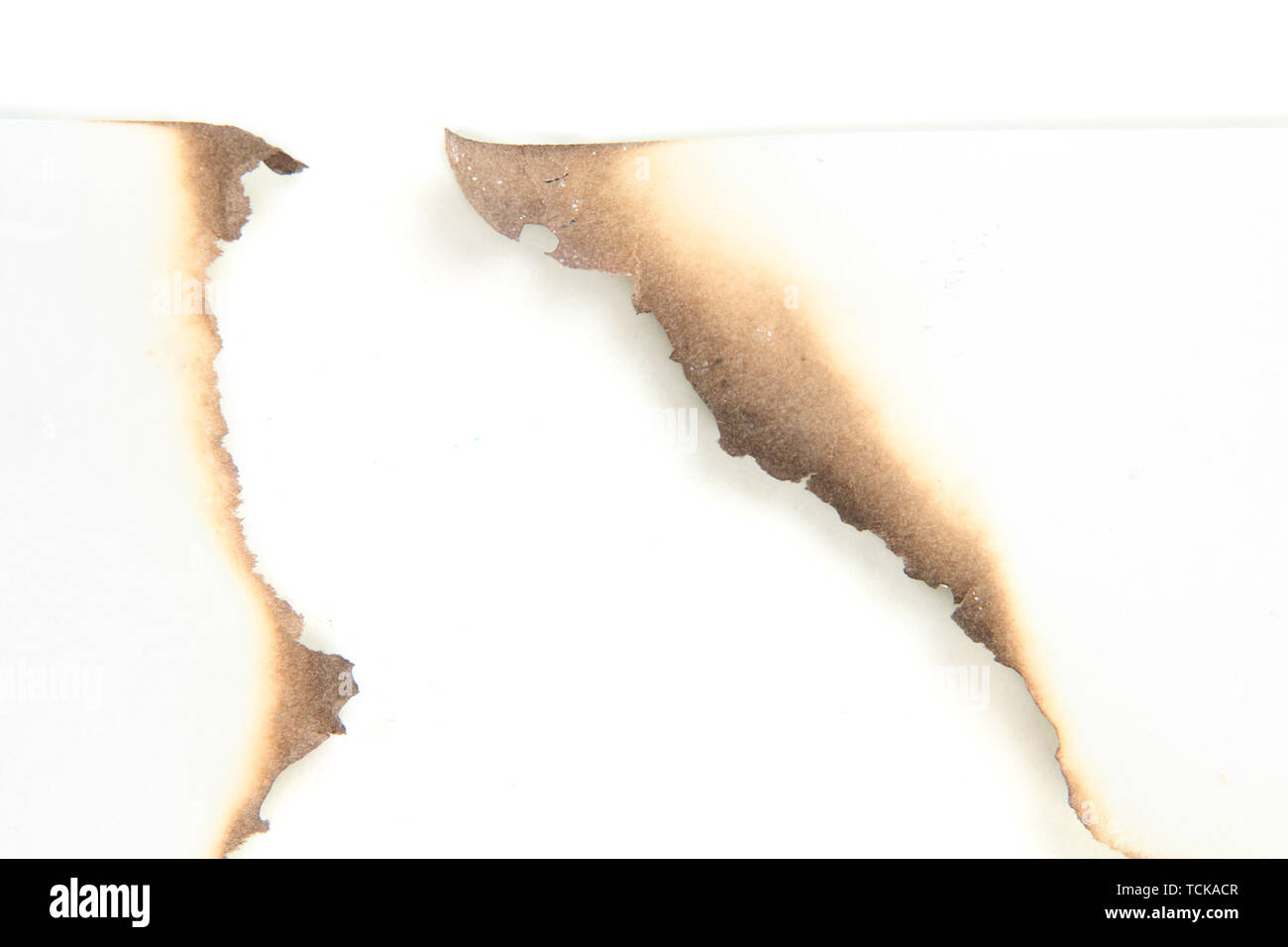 Burnt paper isolated on white Stock Photo - Alamy