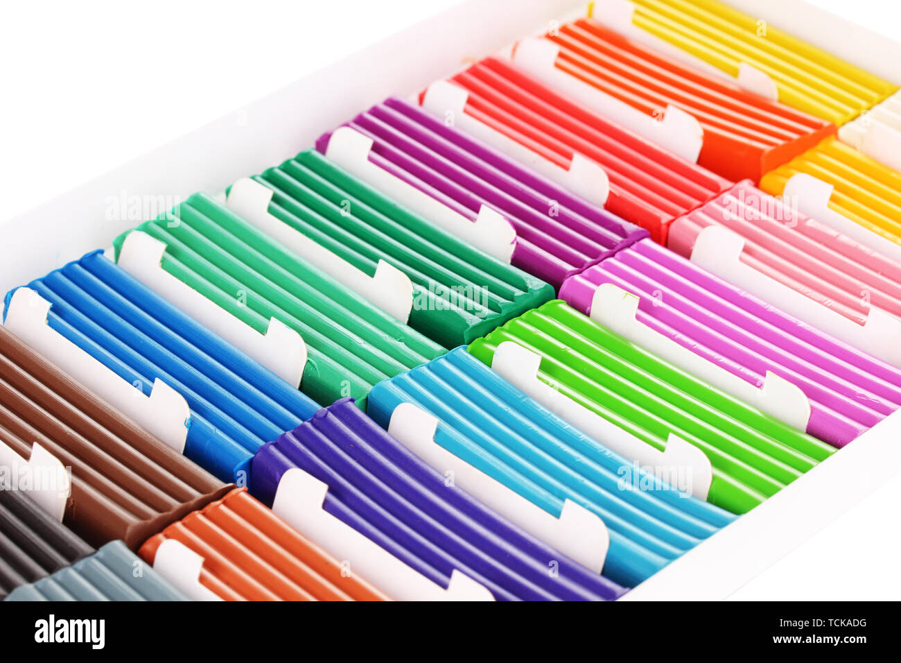 Children bright plasticine in paper box isolated on white Stock Photo ...