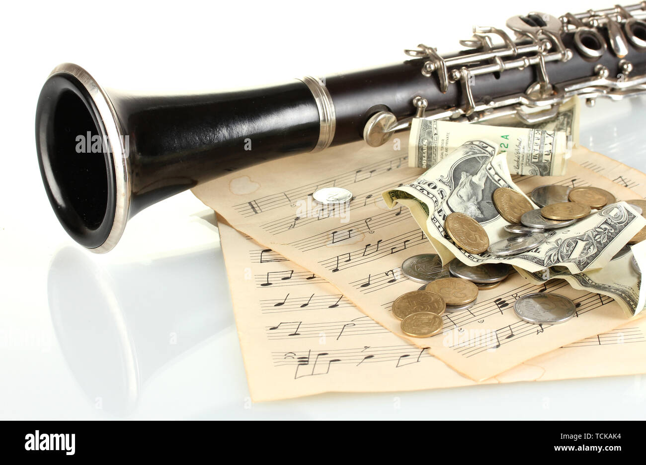 musical instrument with money isolated on white Stock Photo - Alamy
