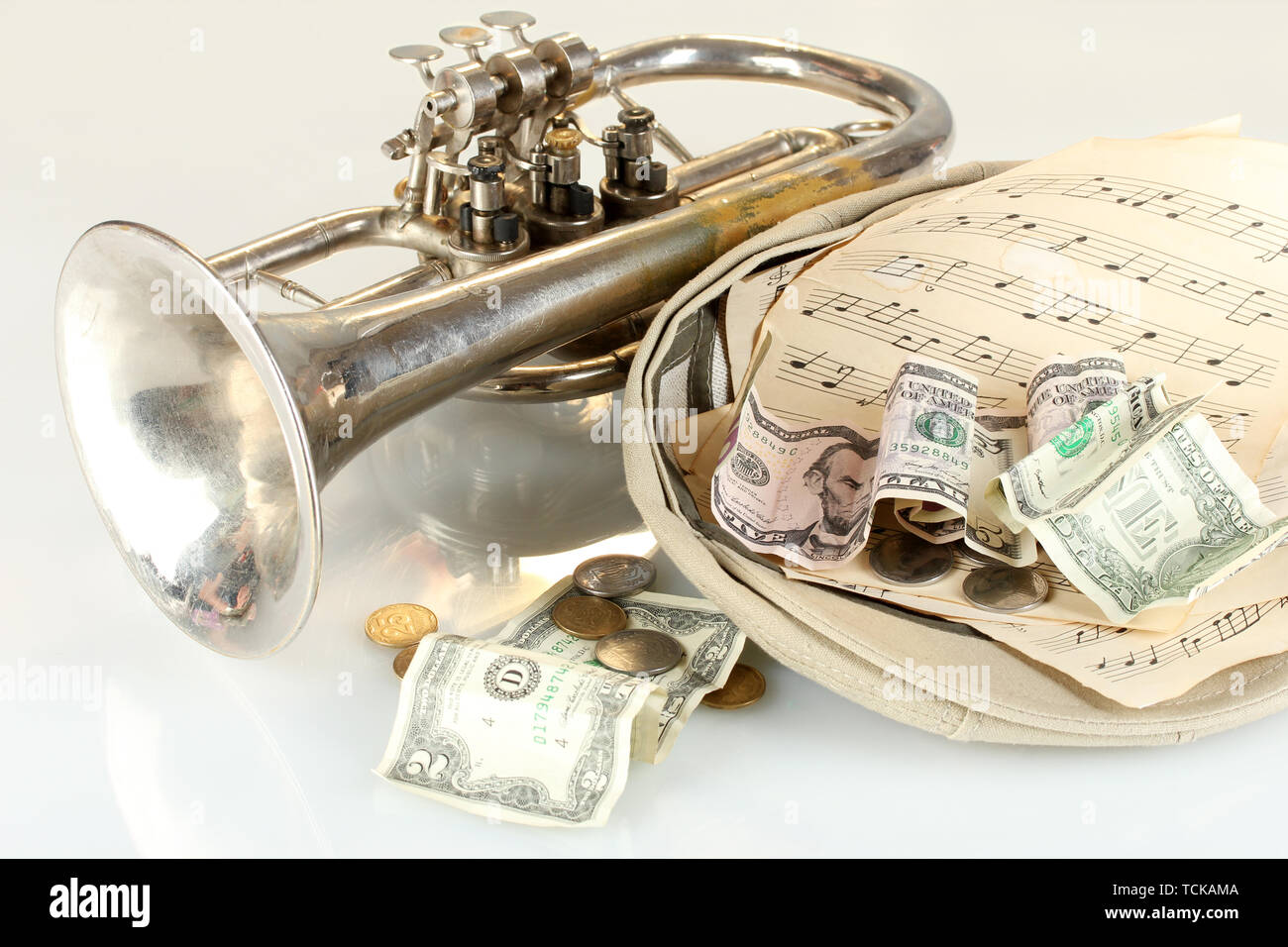 musical instrument with money isolated on white Stock Photo - Alamy