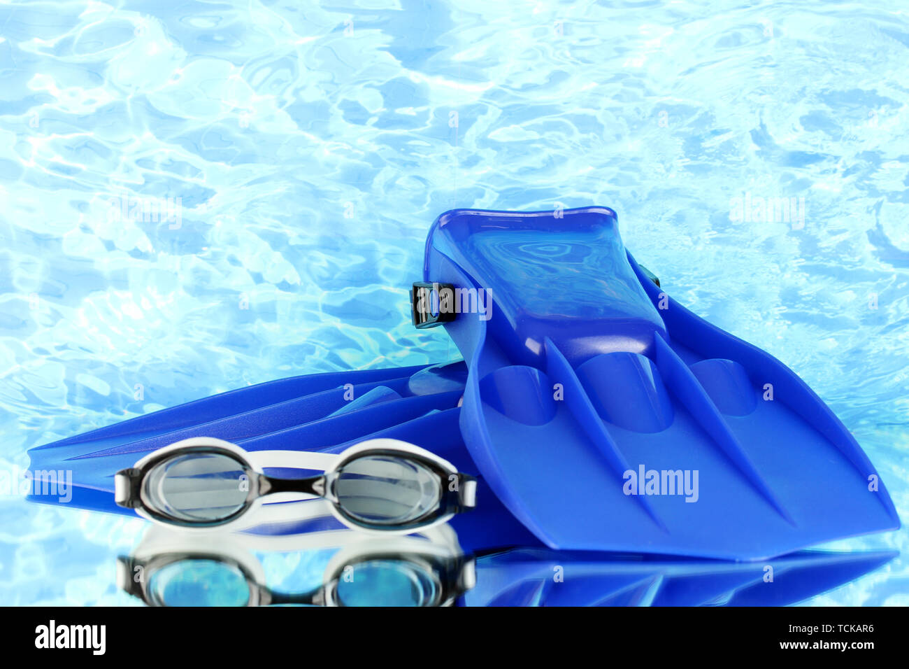 blue flippers and goggles on blue sea background Stock Photo - Alamy