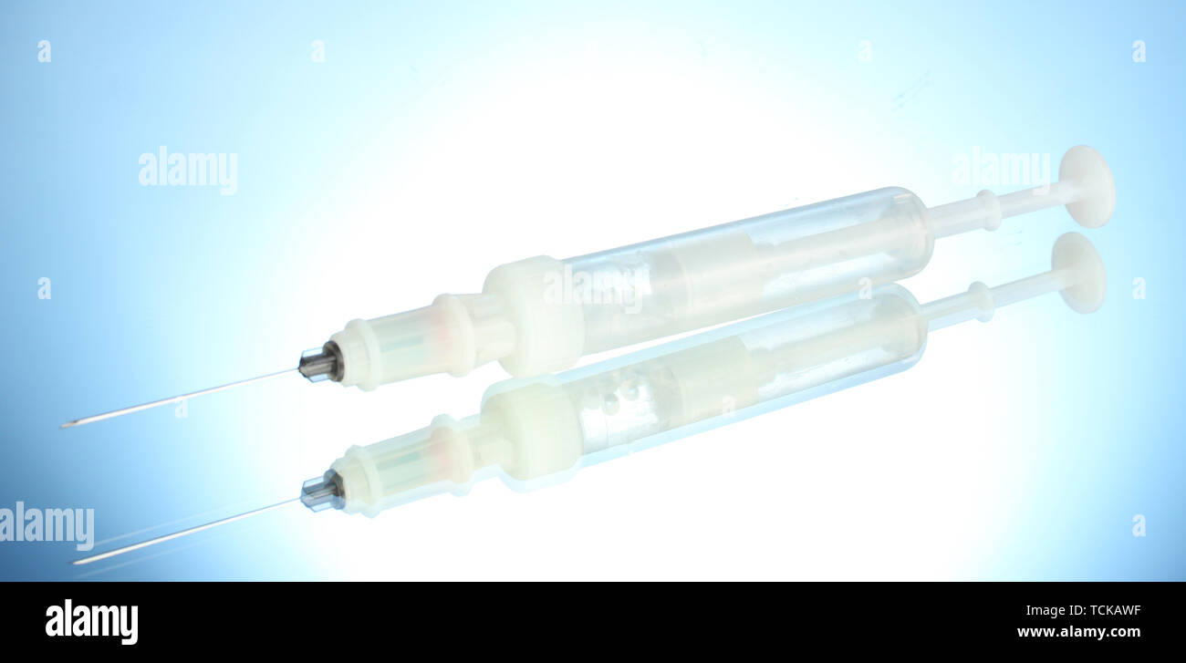 syringe monovet on blue background Stock Photo - Alamy