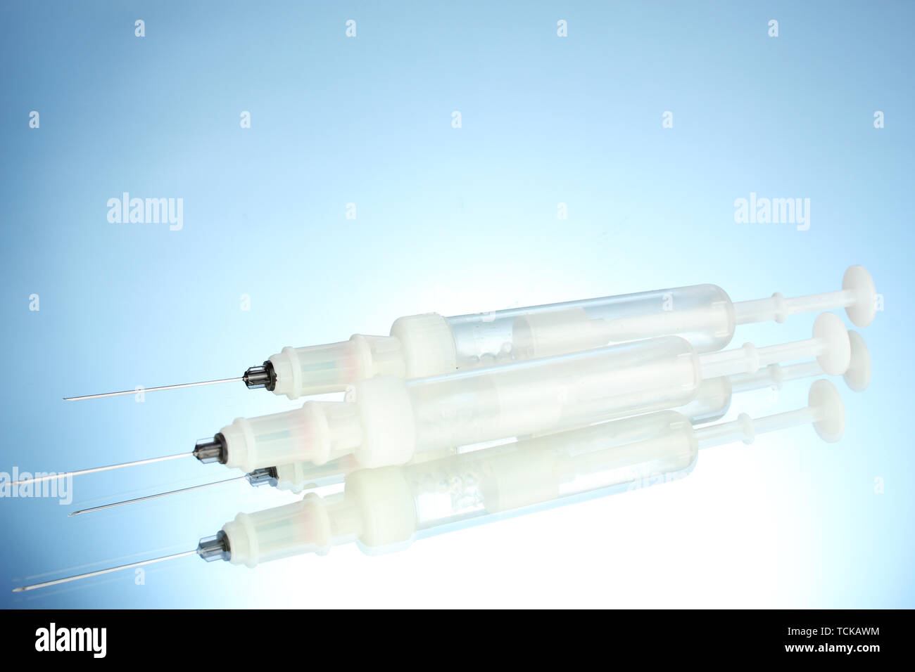 syringes monovet on blue background Stock Photo - Alamy