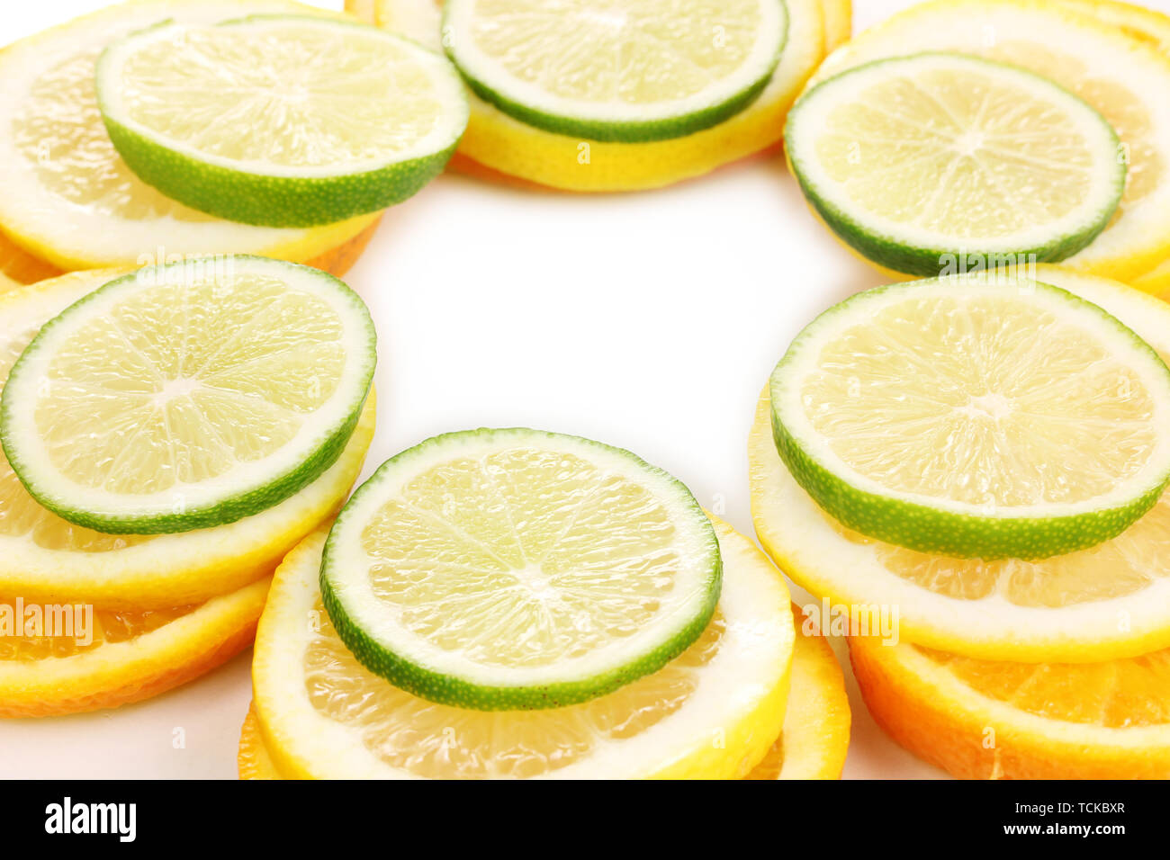 Orange lime and lemon close up isolated on white Stock Photo - Alamy