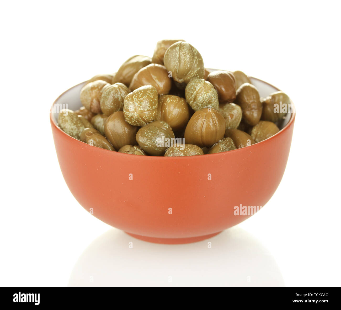 green capers in ceramical bowl isolated on white background Stock Photo ...