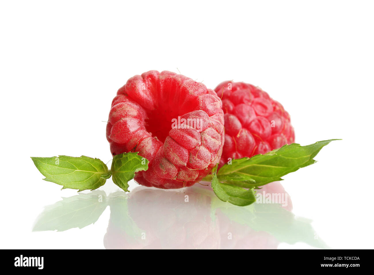 ripe raspberries with mint isolated on white Stock Photo - Alamy