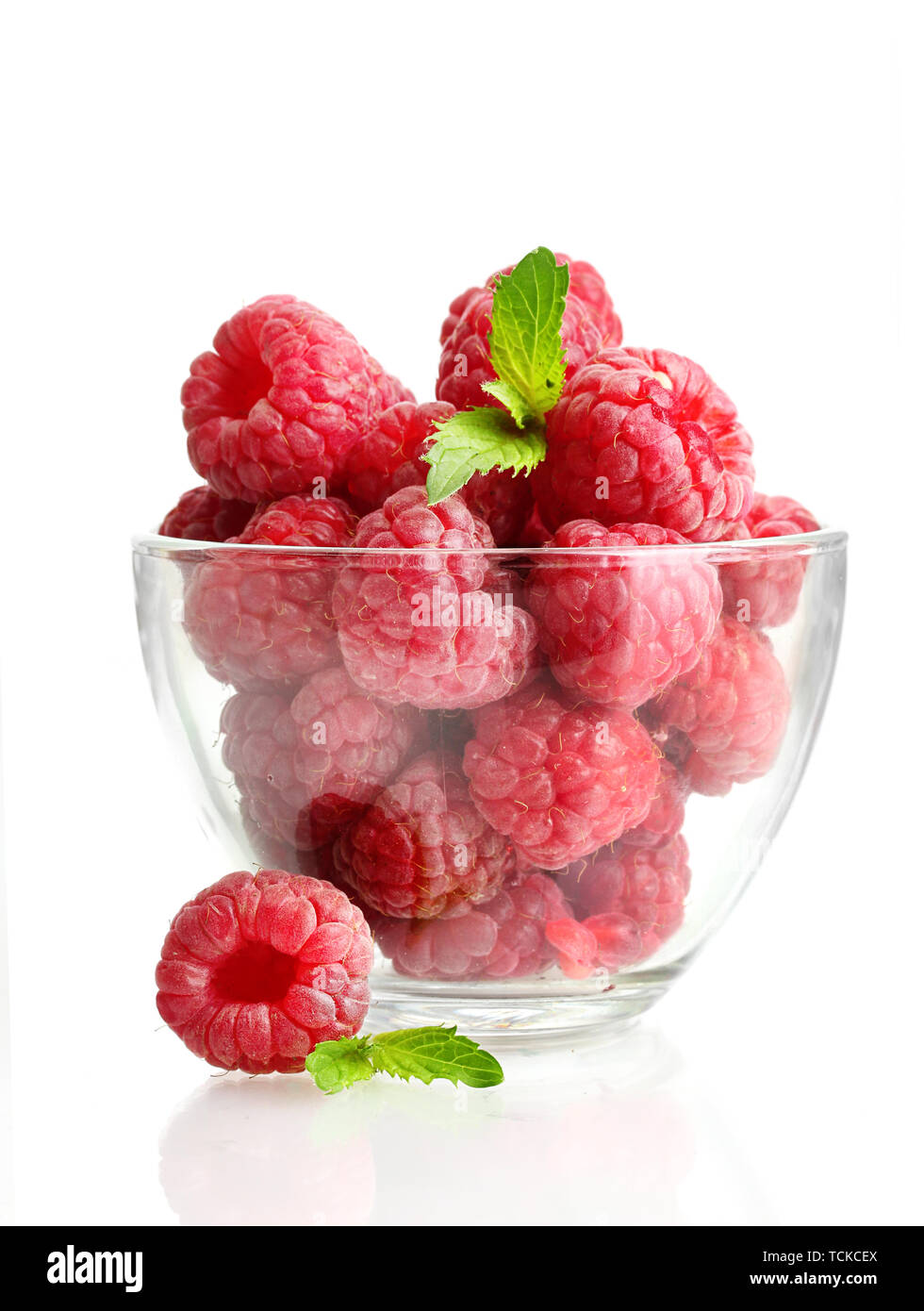 ripe raspberries with mint in glass bowl isolated on white Stock Photo ...