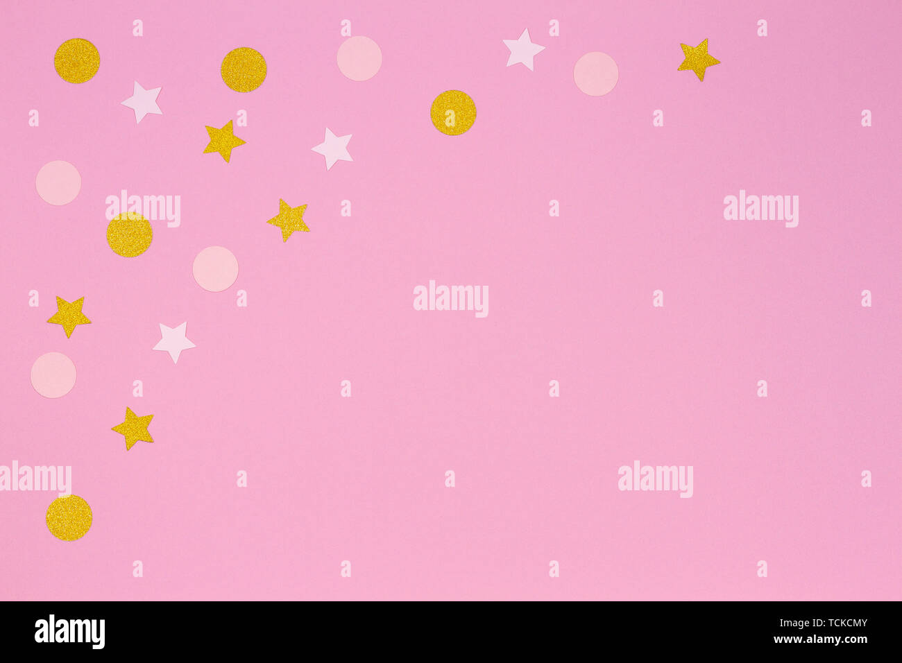 Festive pink background. Colorful confetti and golden stars on light ...