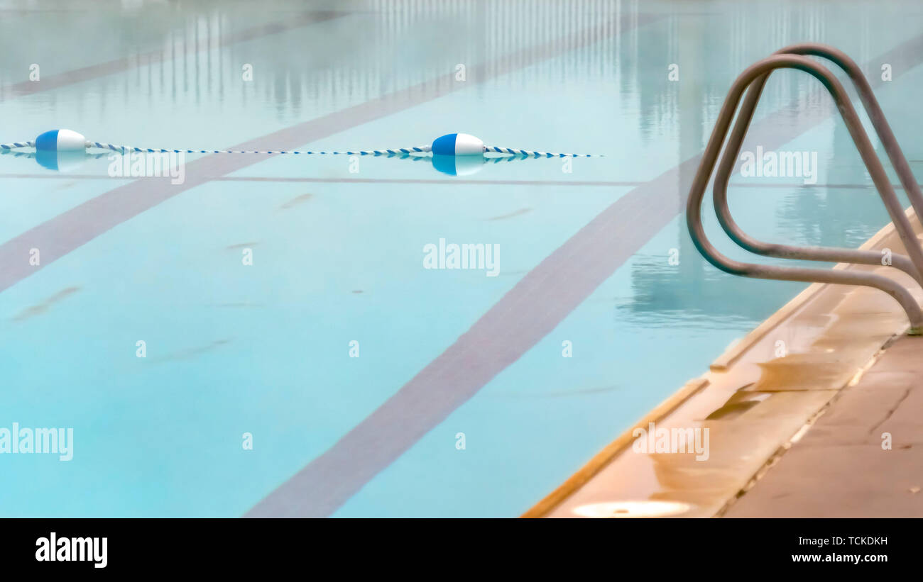 Panorama Blue and white buoy and rope lane marker floating on an ...