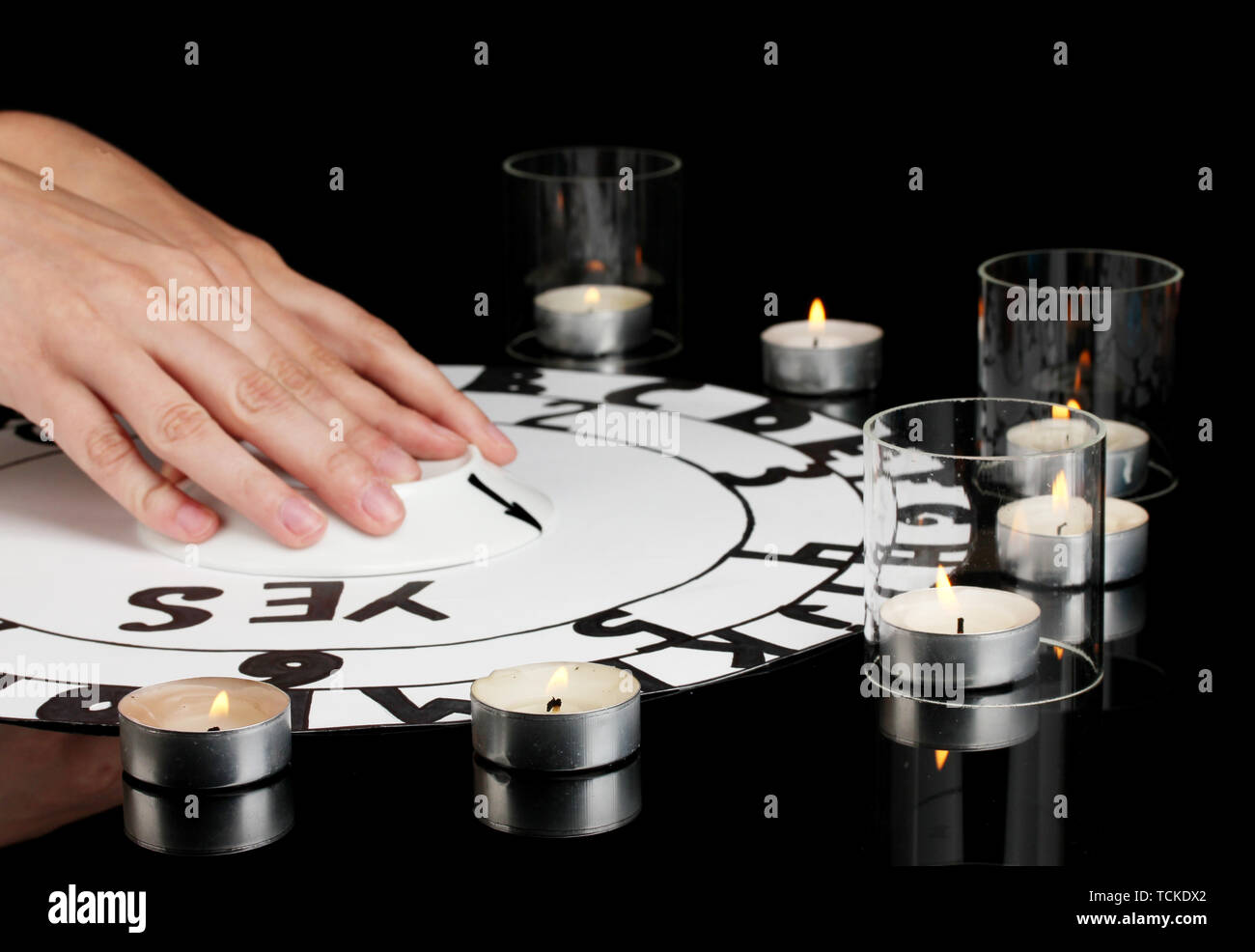 spiritualistic seance by candlelight close-up Stock Photo - Alamy
