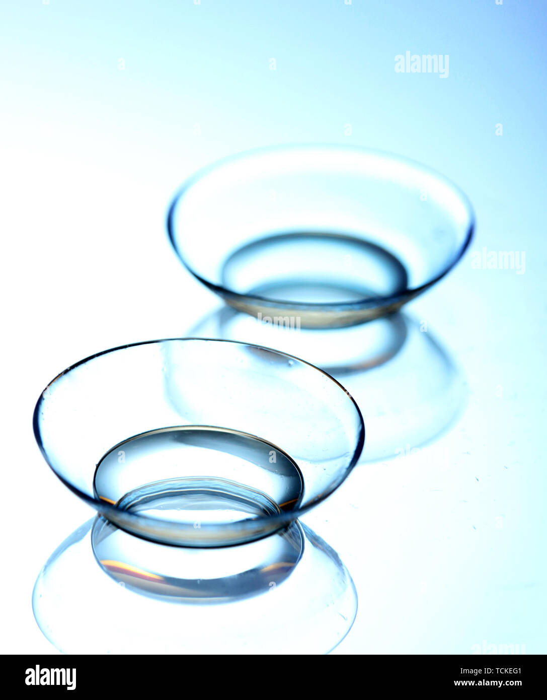 contact lenses, on blue background Stock Photo - Alamy