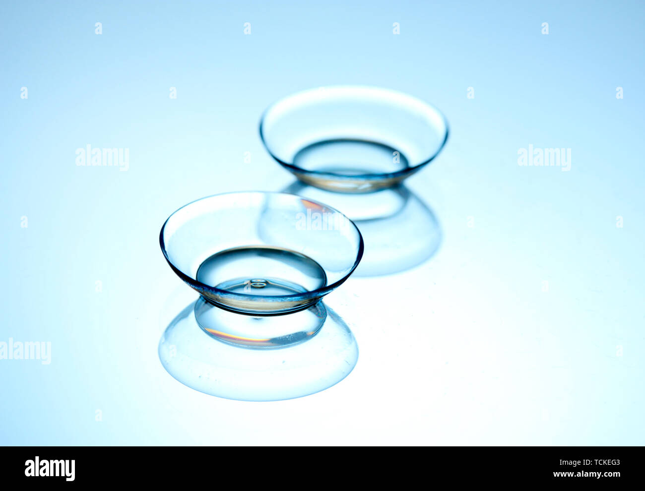 contact lenses, on blue background Stock Photo - Alamy