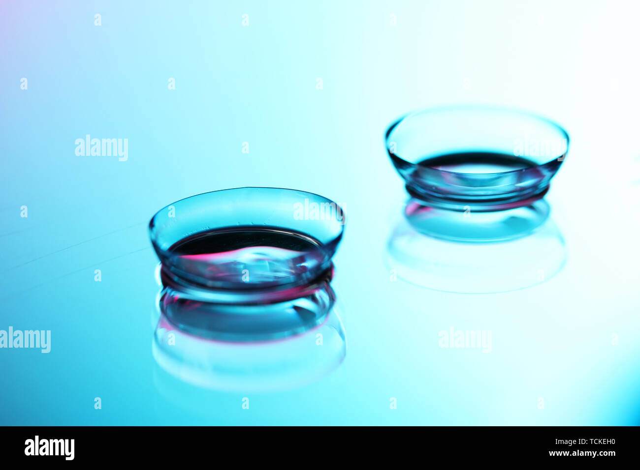contact lenses, on blue background Stock Photo - Alamy