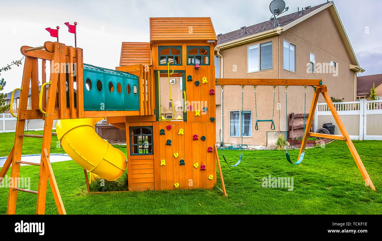 Panorama frame Playground structure with slide swings playhouse tower ...