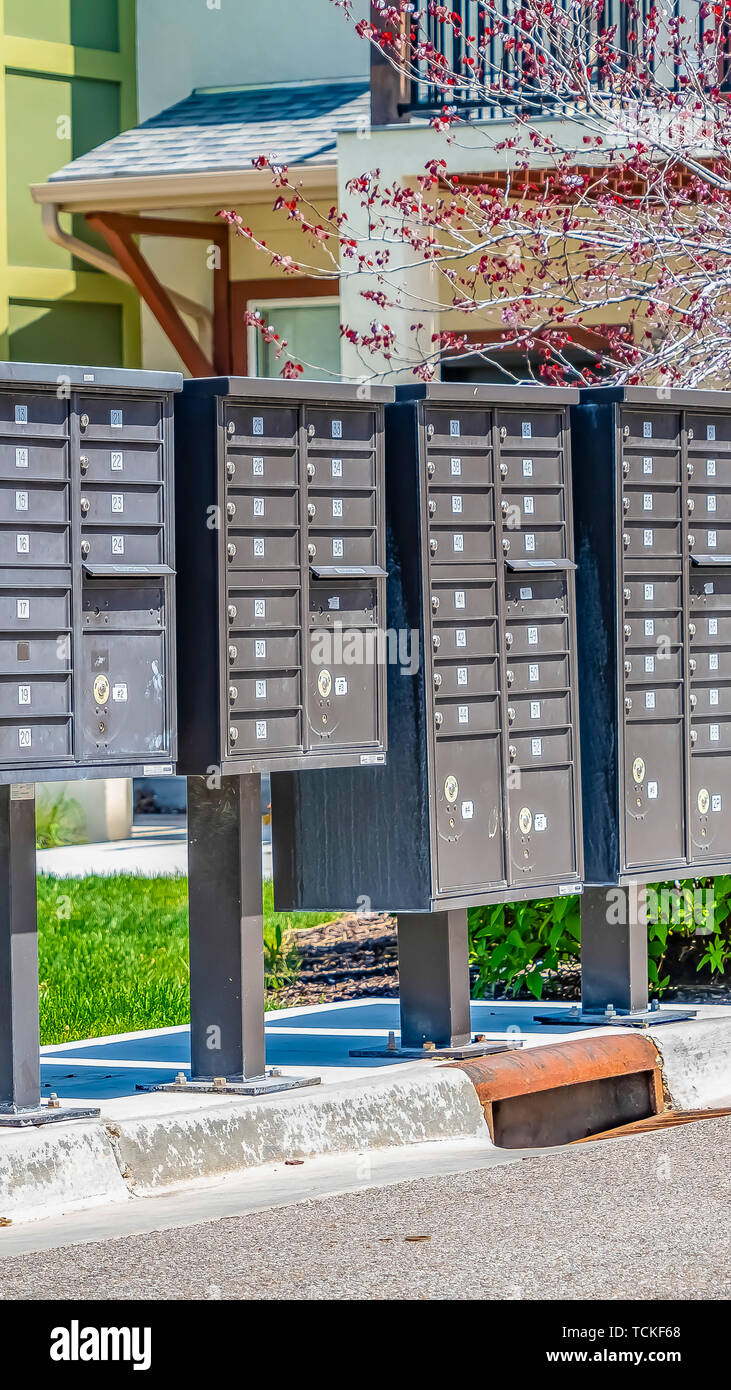 Panorama frame Row of cluster mailboxes with numbered compartments on a ...